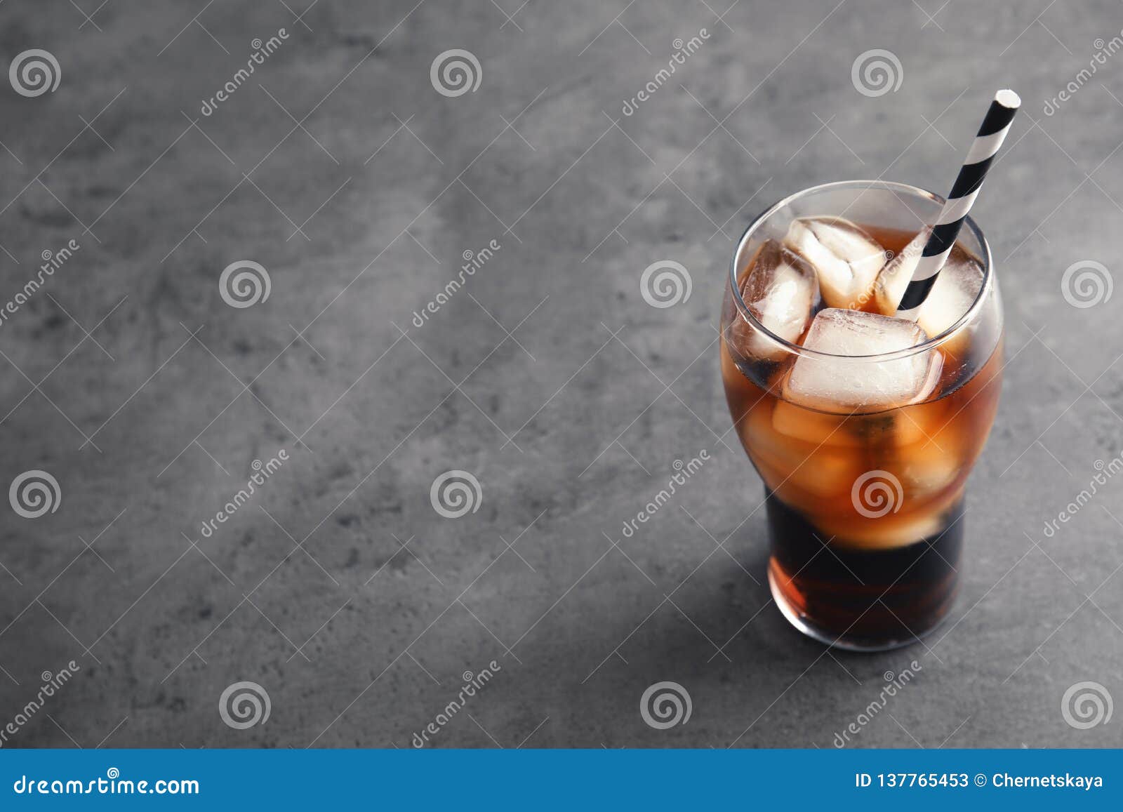 Glass of Refreshing Cola with Ice on Grey Background Stock Image ...