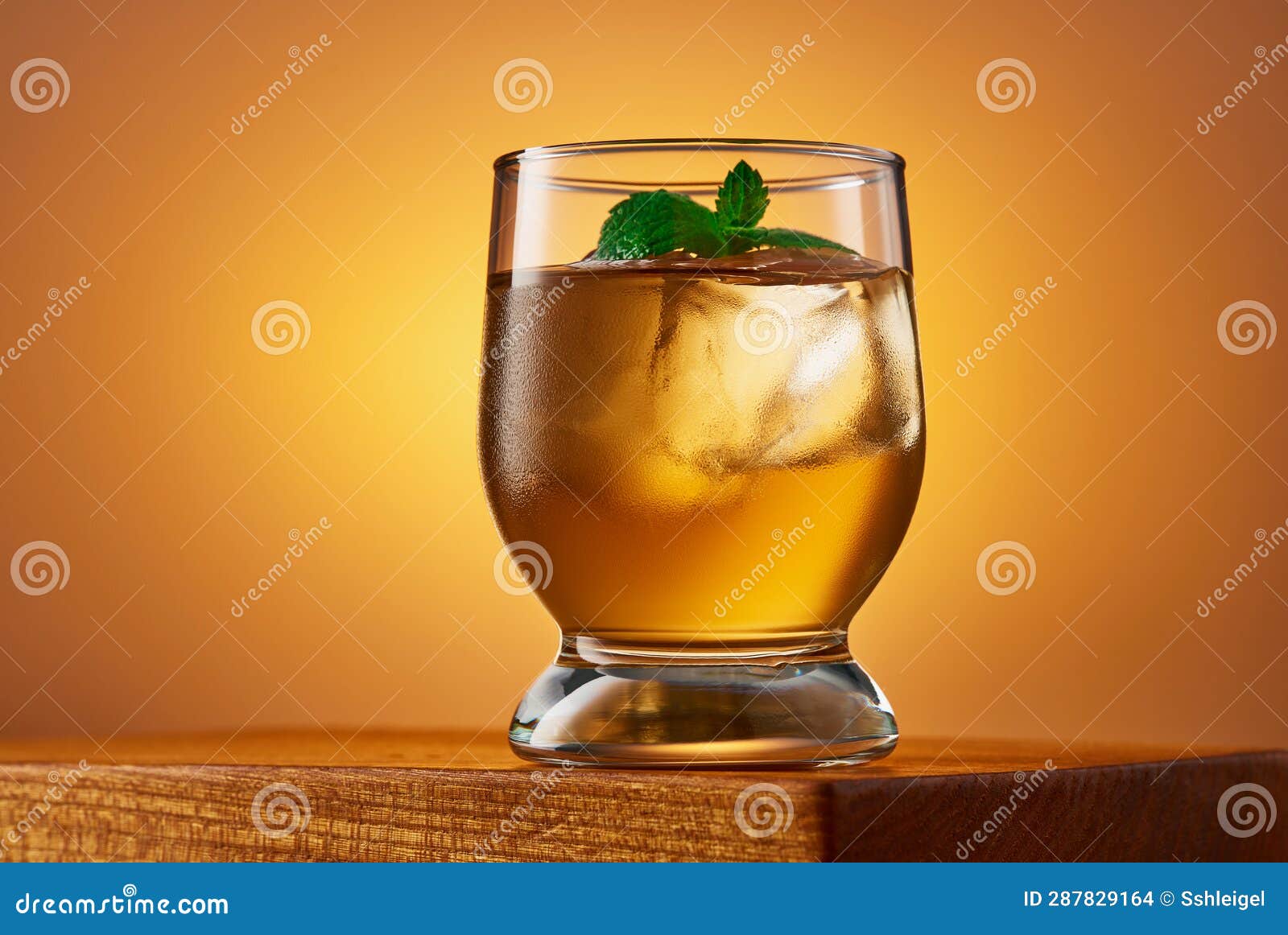 A Glass of Refreshing Iced Tea with Ice Cubes and Mint Leaves. Studio ...