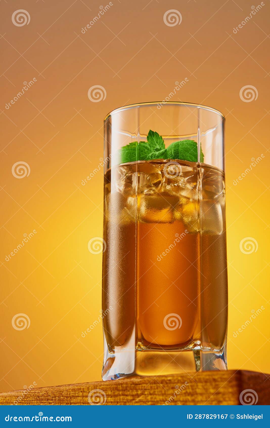 A Glass of Refreshing Iced Tea with Ice Cubes and Mint Leaves. Studio ...