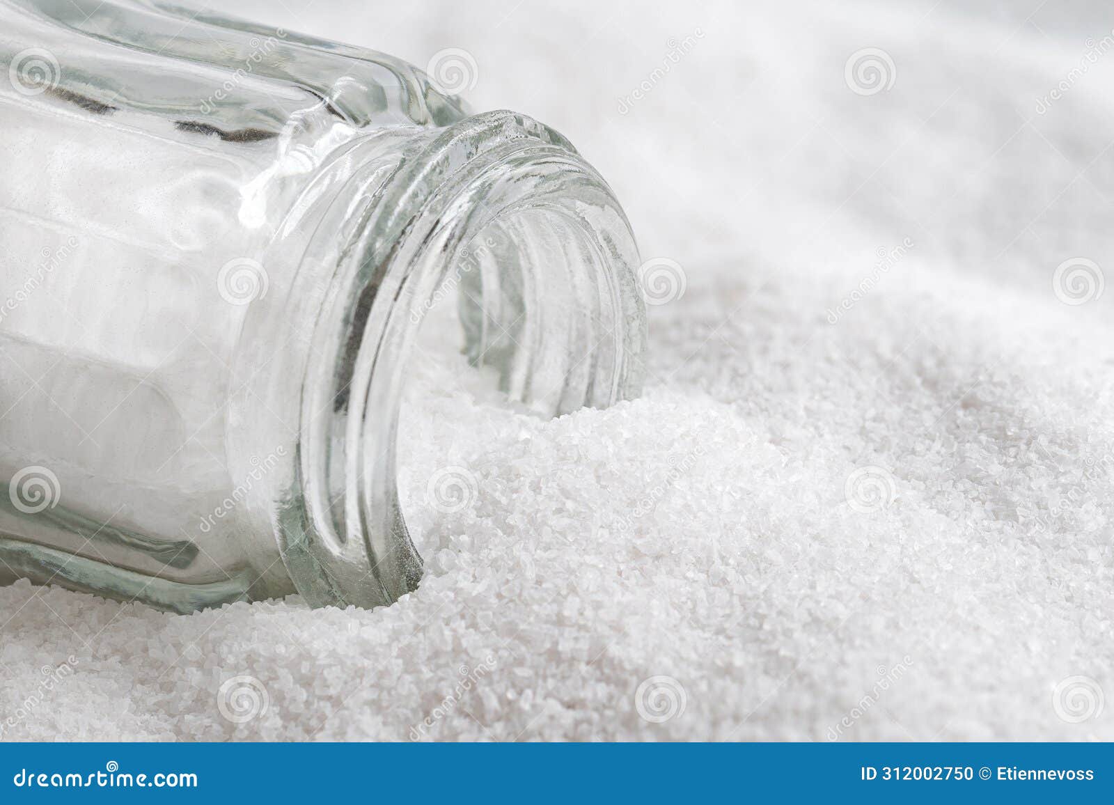 Glass Salt Shaker Lying on Top of Sea Salt Stock Photo - Image of ...