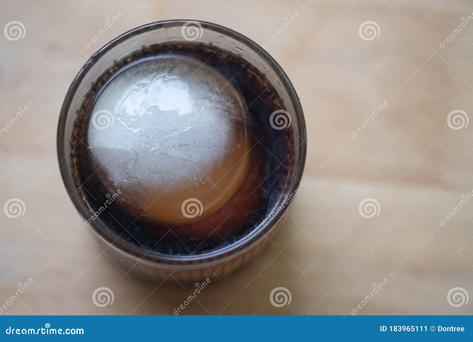 Glass of Soft Drink with Round Ice Ball, Cube Stock Image - Image of ...