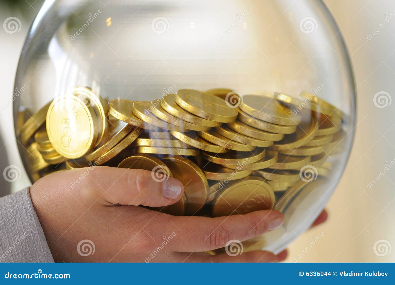 Glass sphere with coins stock photo. Image of gift, hill - 6336944