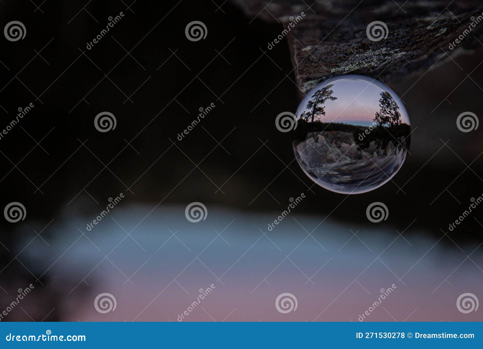 Glass Sphere Reflecting a Tranquil Scene of a Peaceful Lake at Sunset ...