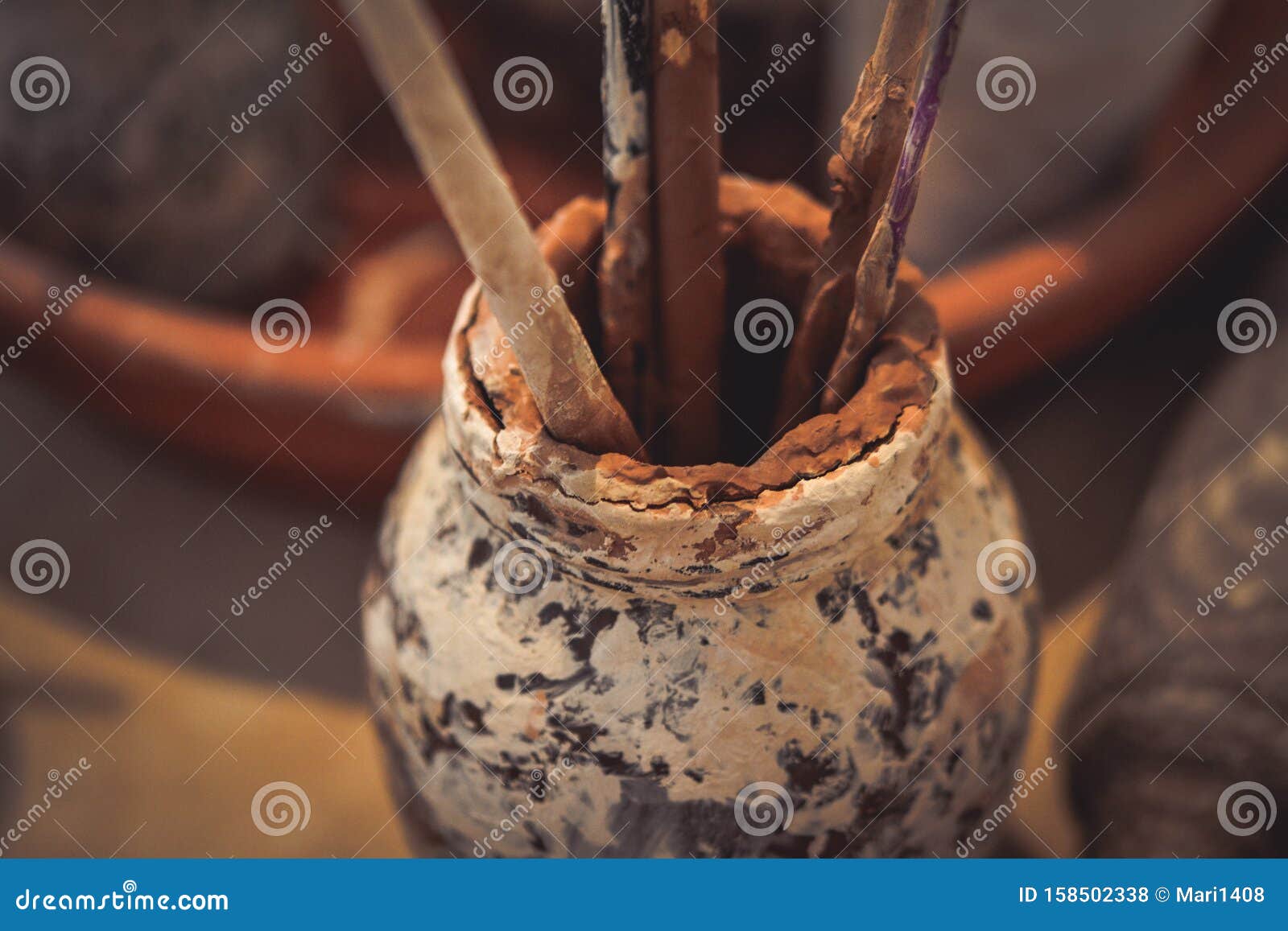 A Glass Stained with Smeared Clay with Tassels Stock Photo - Image of ...
