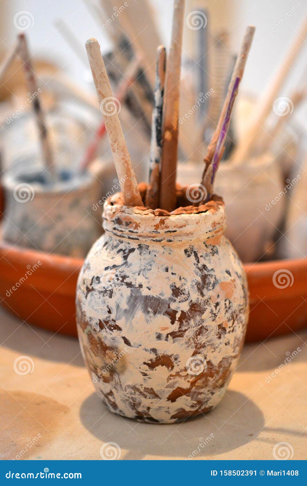 A Glass Stained with Smeared Clay with Tassels Stock Image - Image of ...