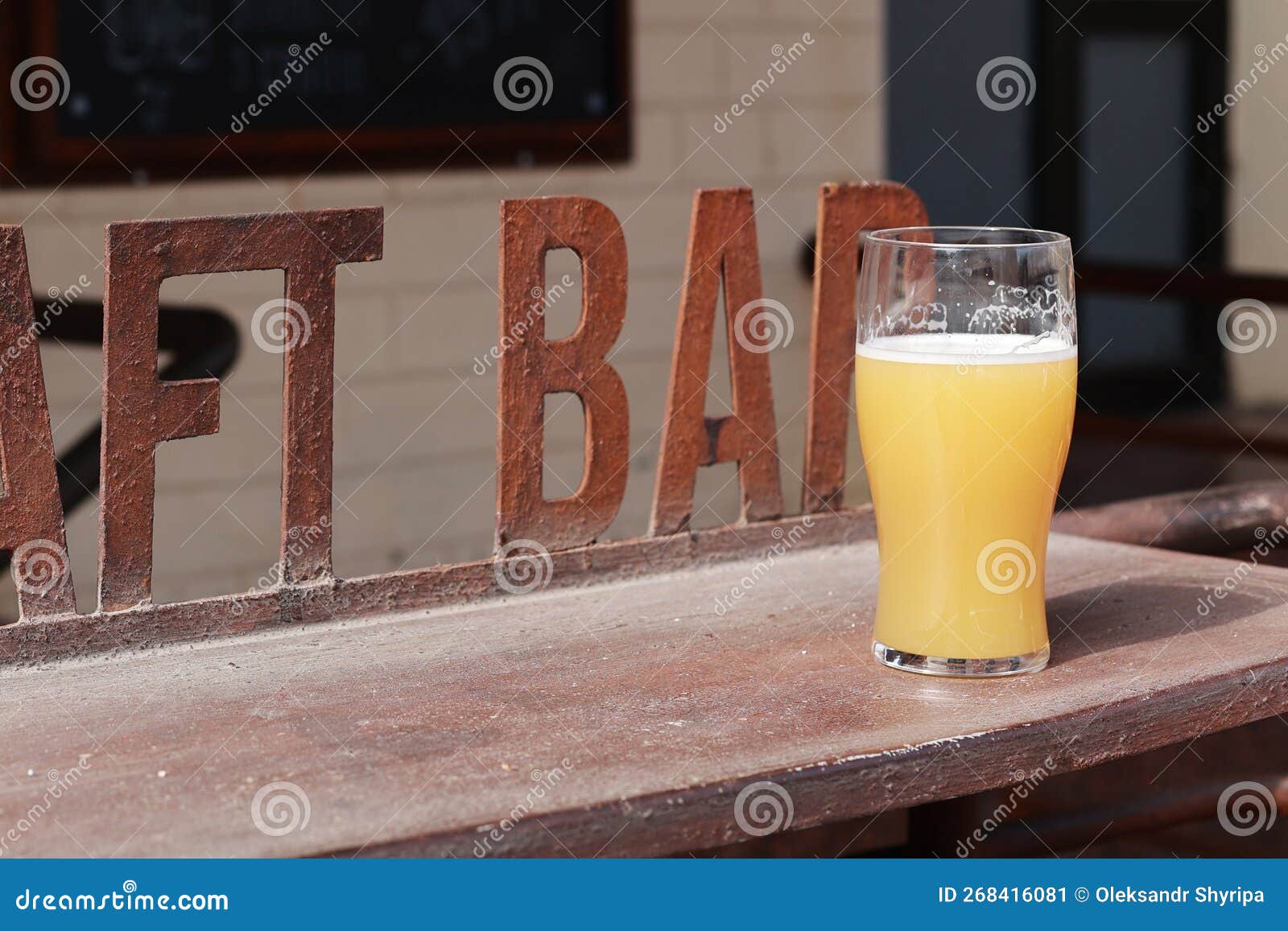 A Glass of Started Beer. a Pint of Unfiltered APA on the Bar Stock ...