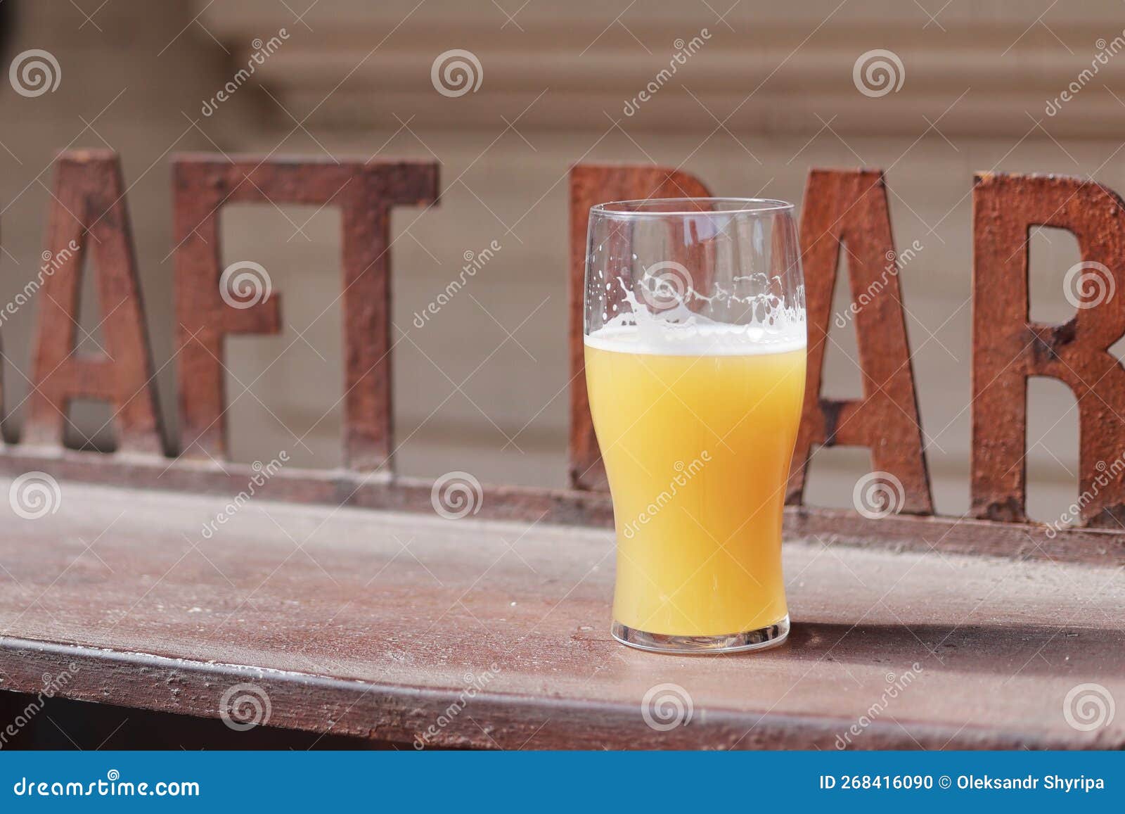 A Glass of Started Beer. a Pint of Unfiltered APA on the Bar Stock ...