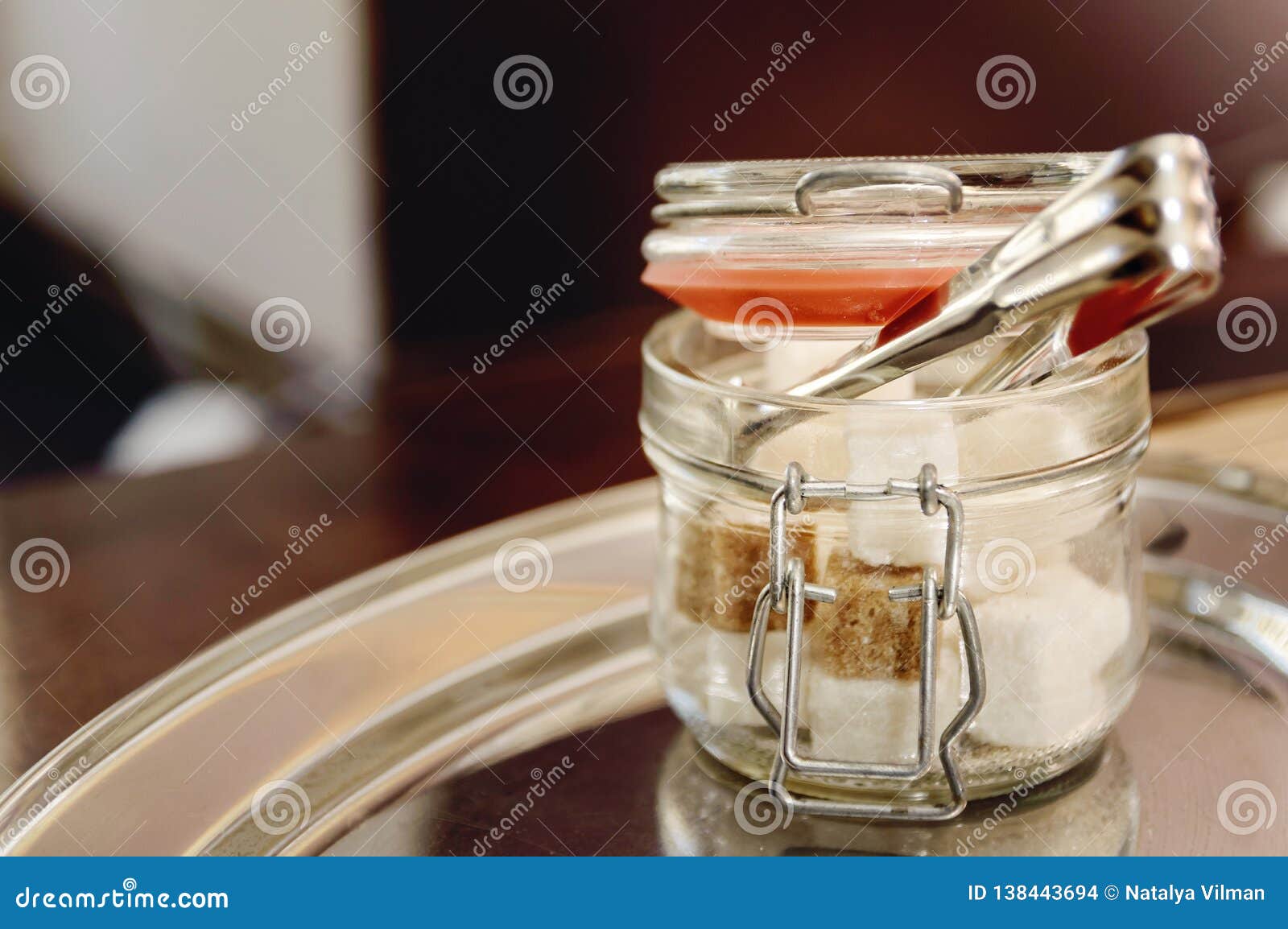 Glass Sugar Bowl with Refined Sugar on a Table in a Cafe. Modern ... Glass Sugar Bowl with Refined Sugar on a Table in a Cafe. Modern ...