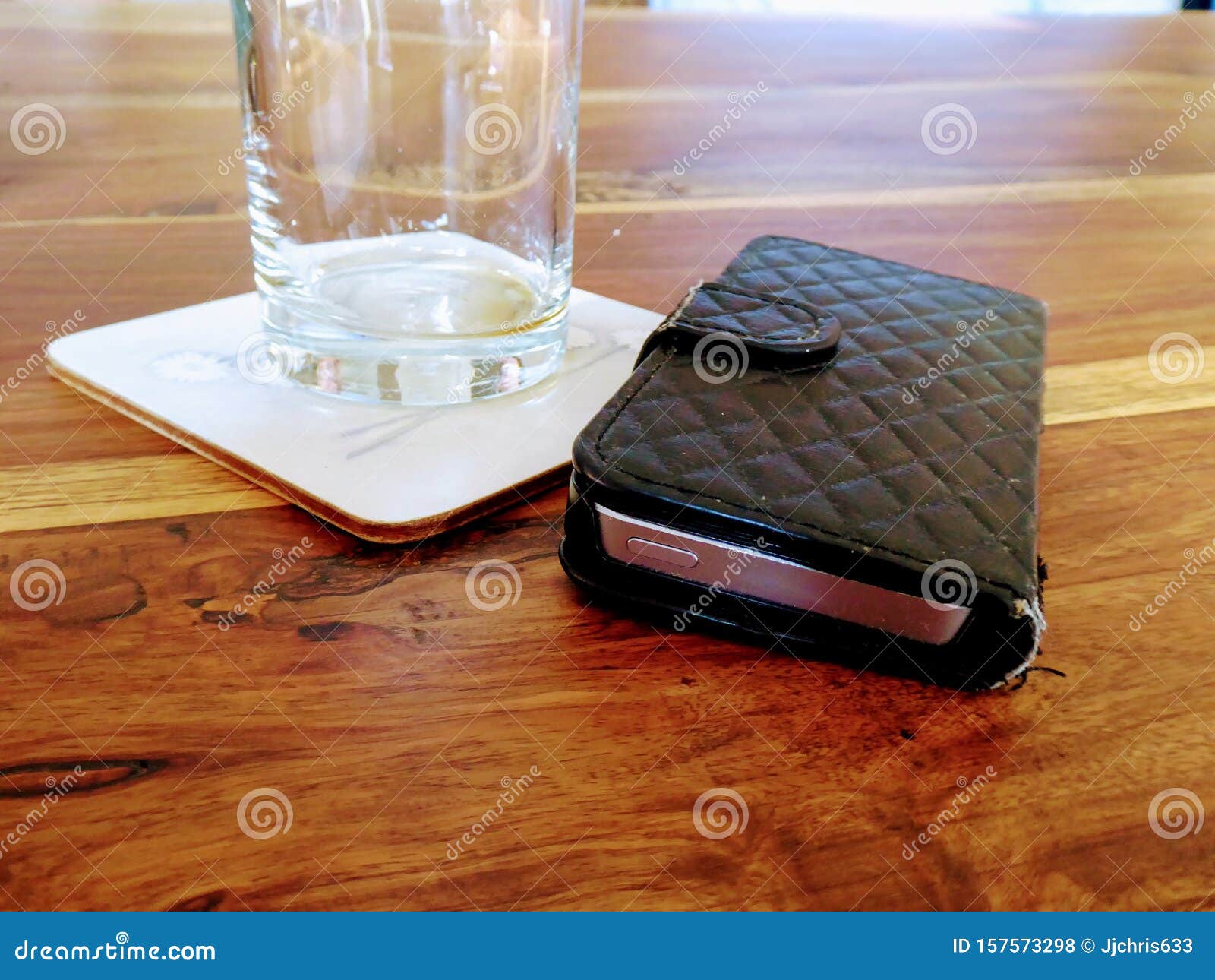 Glass on Table with Mobile Phone, Dinner Table with Phone. Stock Photo ...