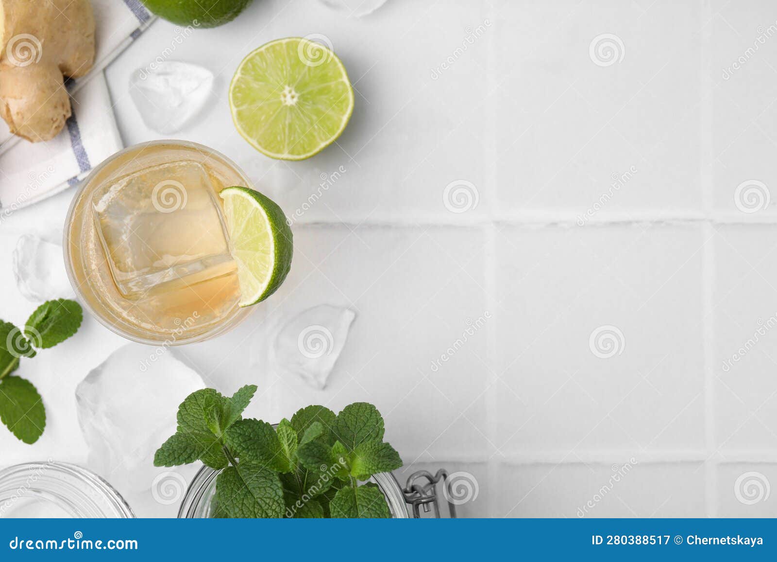 Glass of Tasty Ginger Ale with Ice Cube and Ingredients on White Tiled ...