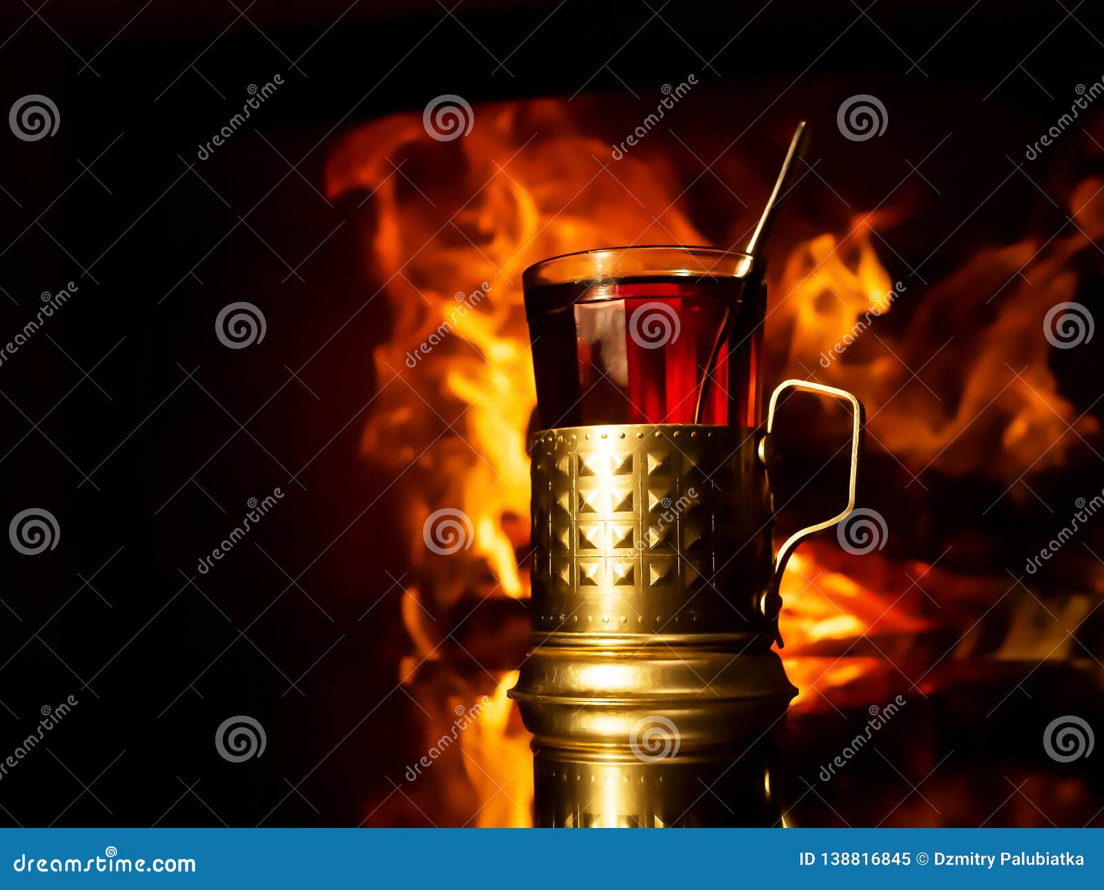 Glass of Tea in the Cup Holder by the Fireplace. Stock Image - Image of ...