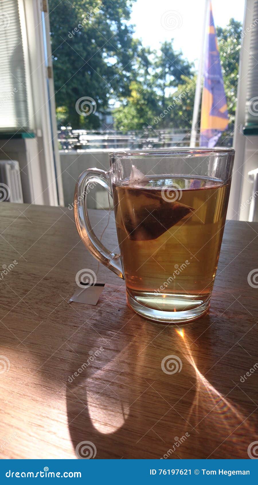 Glass of tea stock image. Image of teabag, glass, table - 76197621