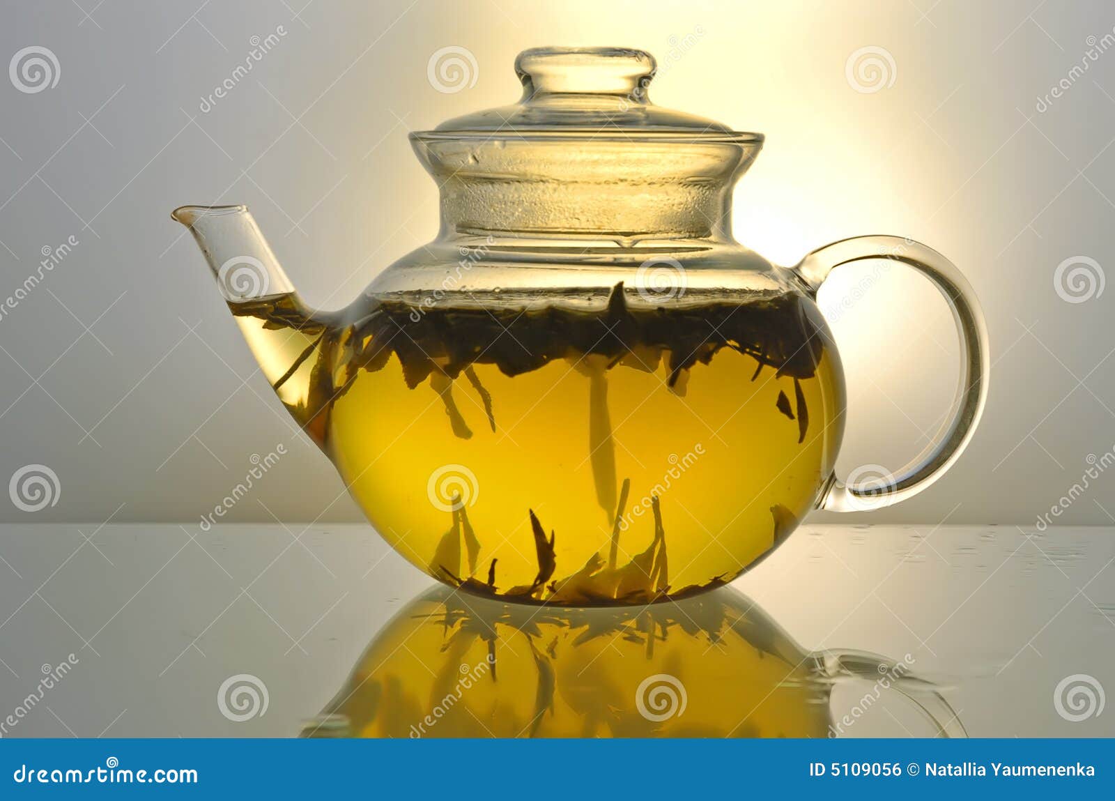 A Glass Teapot With Delicious Vitamin Orange Tea Stands On A Stand With ...