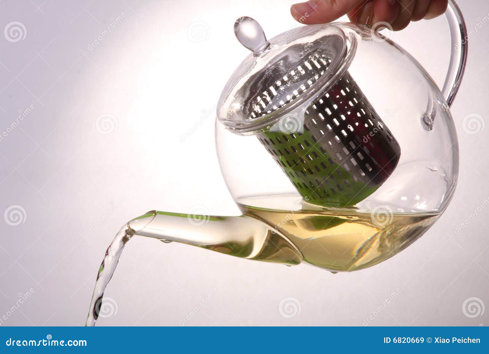 A Glass Teapot With Delicious Vitamin Orange Tea Stands On A Stand With ...