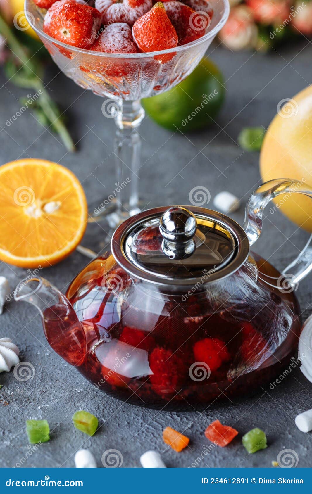 Glass Teapot with Fruit Raspberry Tea and Mint on a Blue Background ...