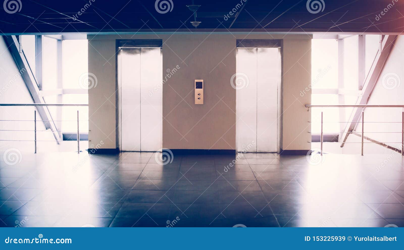 Glass Wall with Two Elevators in the Office Building, There is a Stock ...