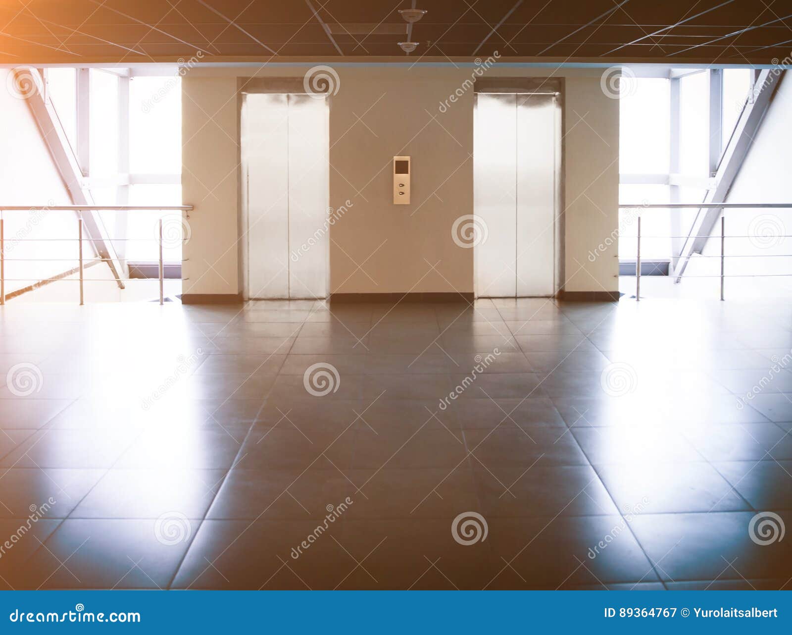 Glass Wall with Two Elevators in the Office Building, There is an Empty ...
