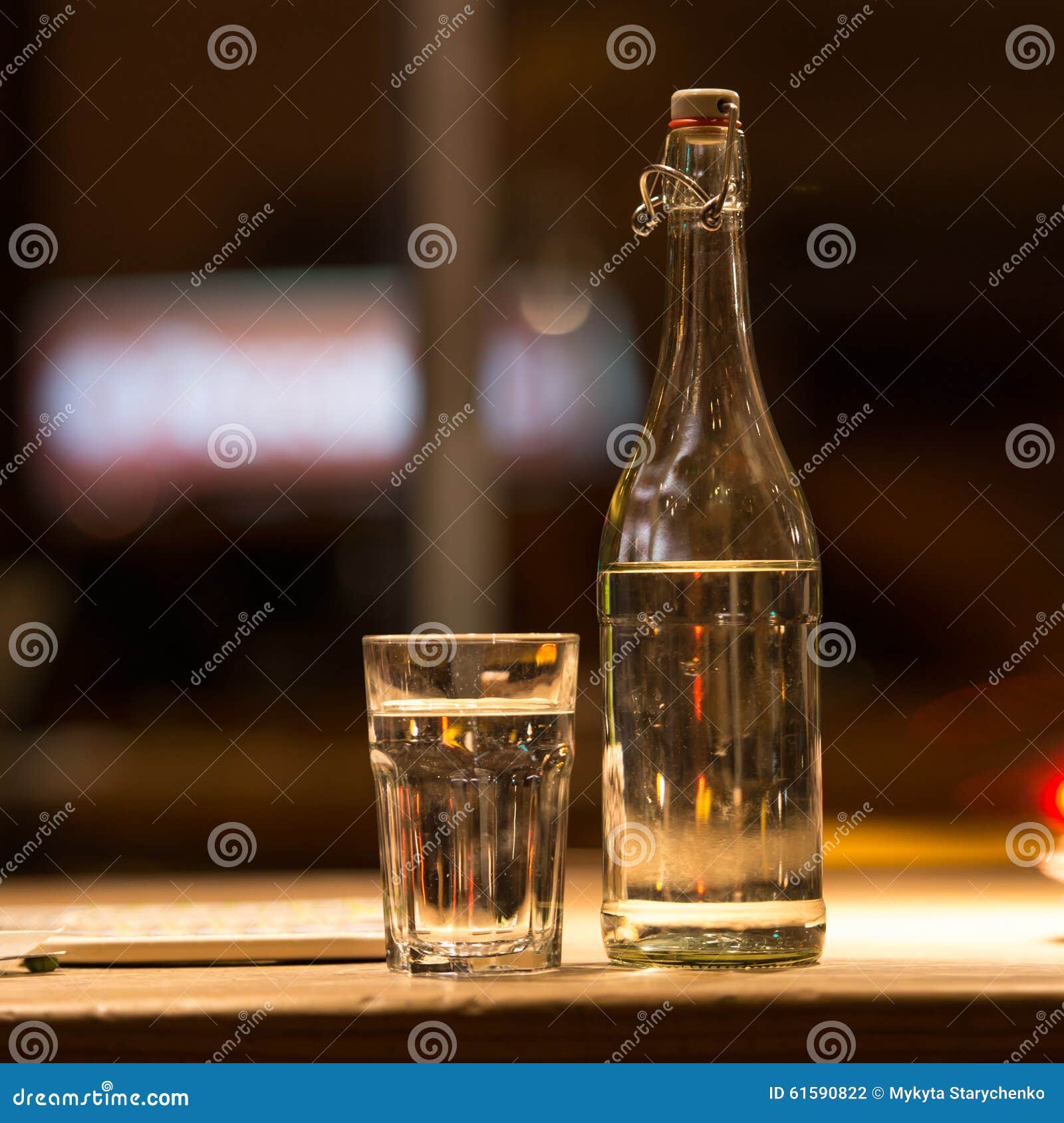 Glass of Water and a Bottle at the Restaurant Table Stock Photo - Image ...