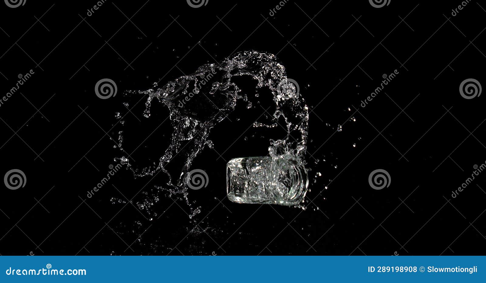Glass of Water Bouncing and Splashing on Black Background Stock Photo ...