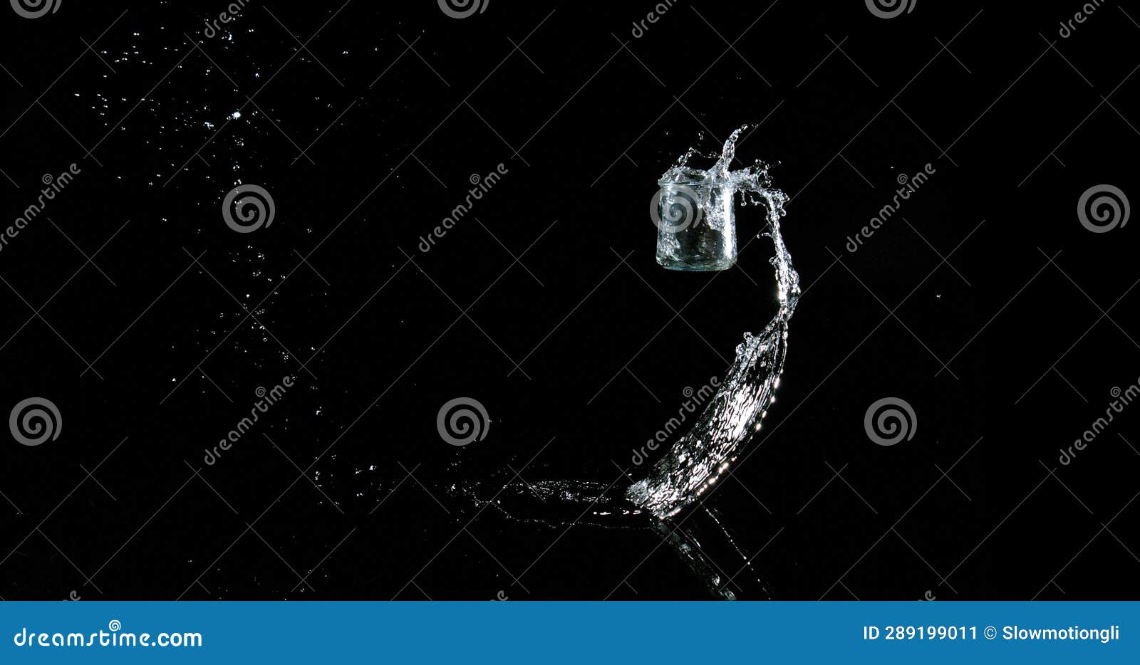 Glass of Water Bouncing and Splashing on Black Background Stock Image ...