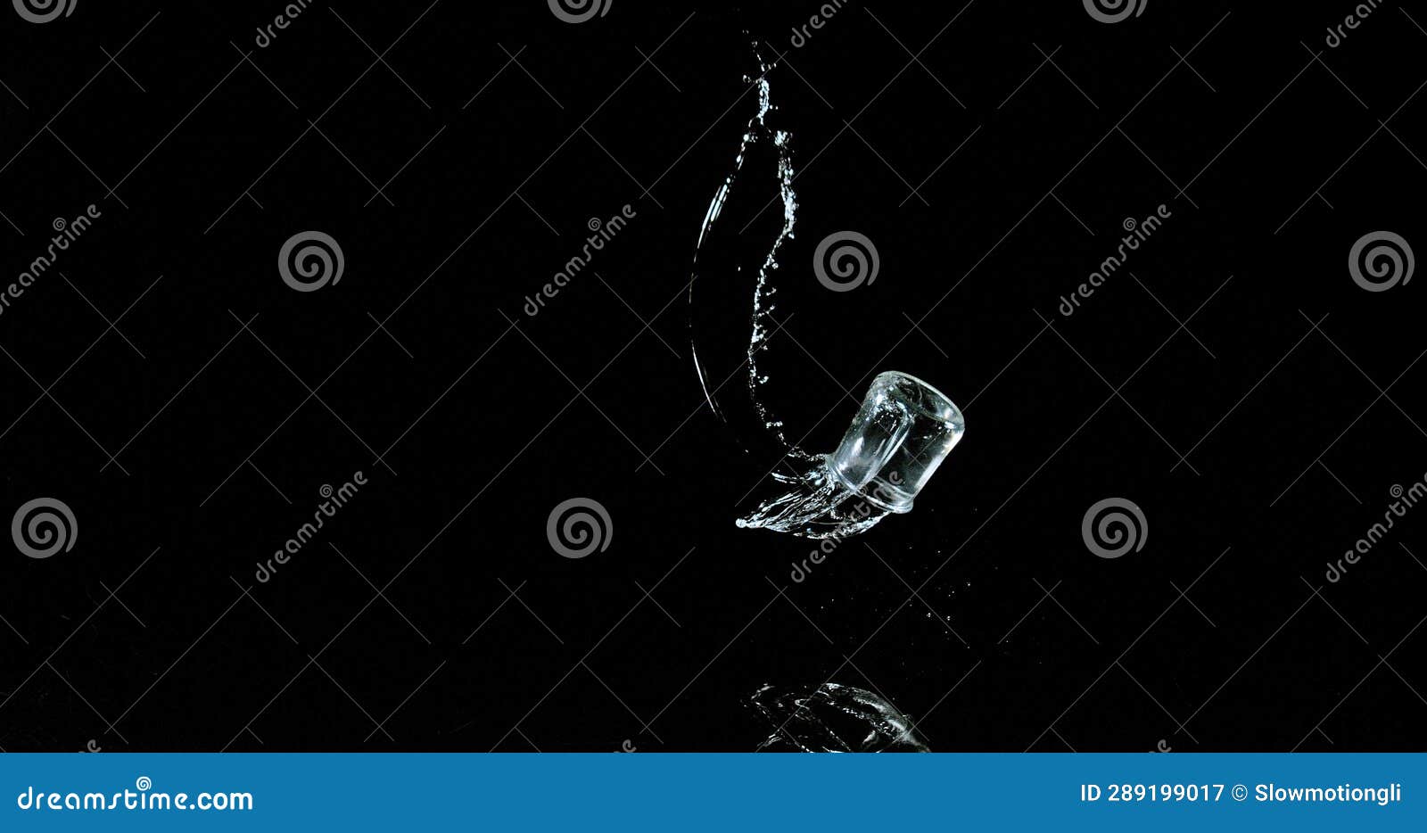 Glass of Water Bouncing and Splashing on Black Background Stock Image ...