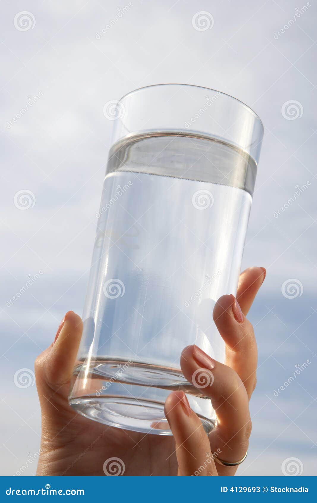 Glass of water in hand stock image. Image of water, spring - 4129693