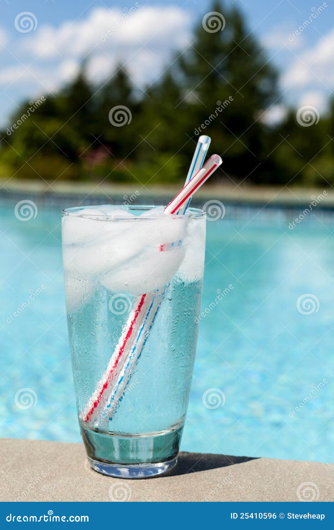 Glass of Water with Ice Cubes on Side of Pool Stock Photo - Image of ...