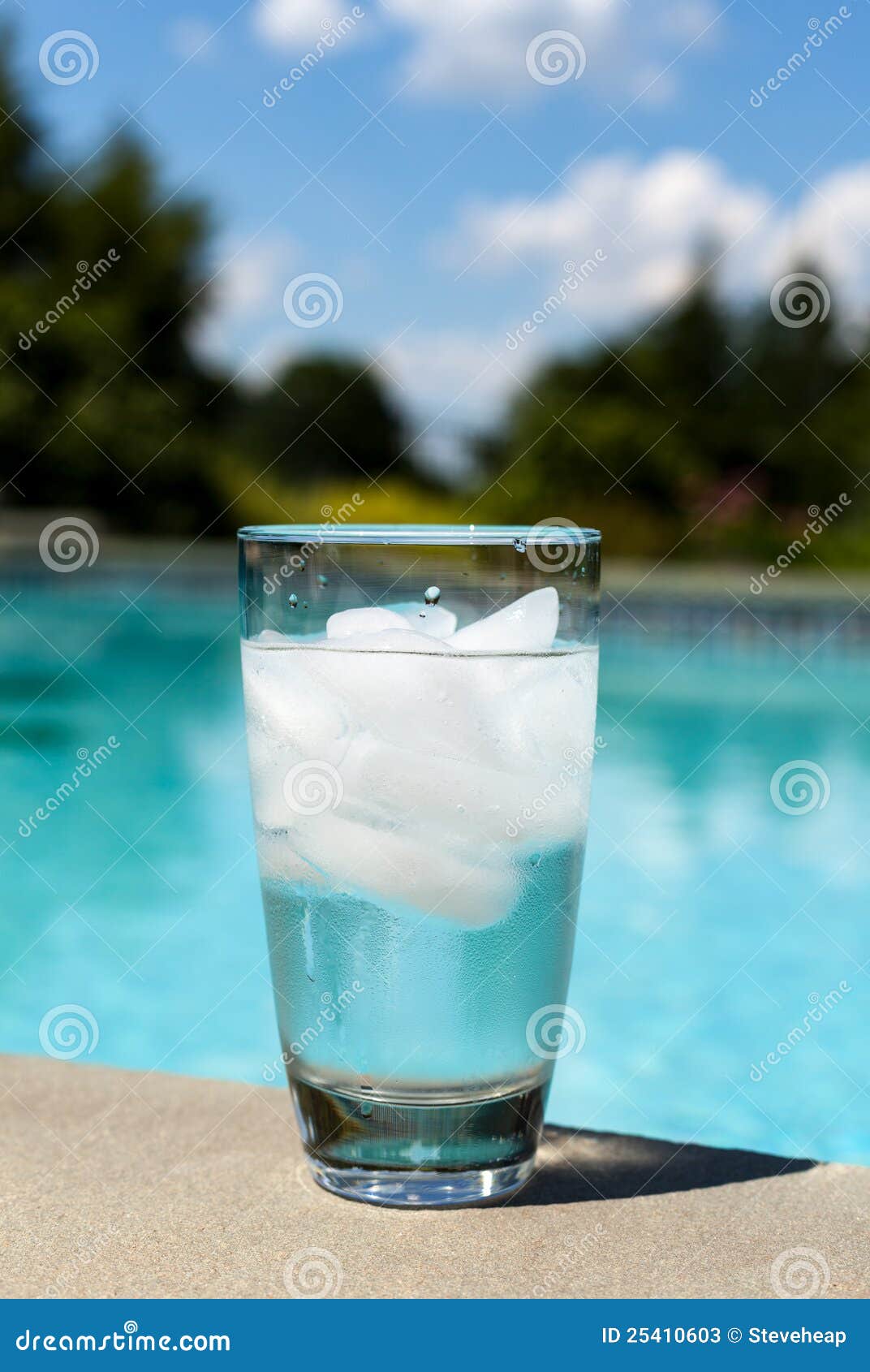 Glass of Water with Ice Cubes on Side of Pool Stock Image - Image of ...