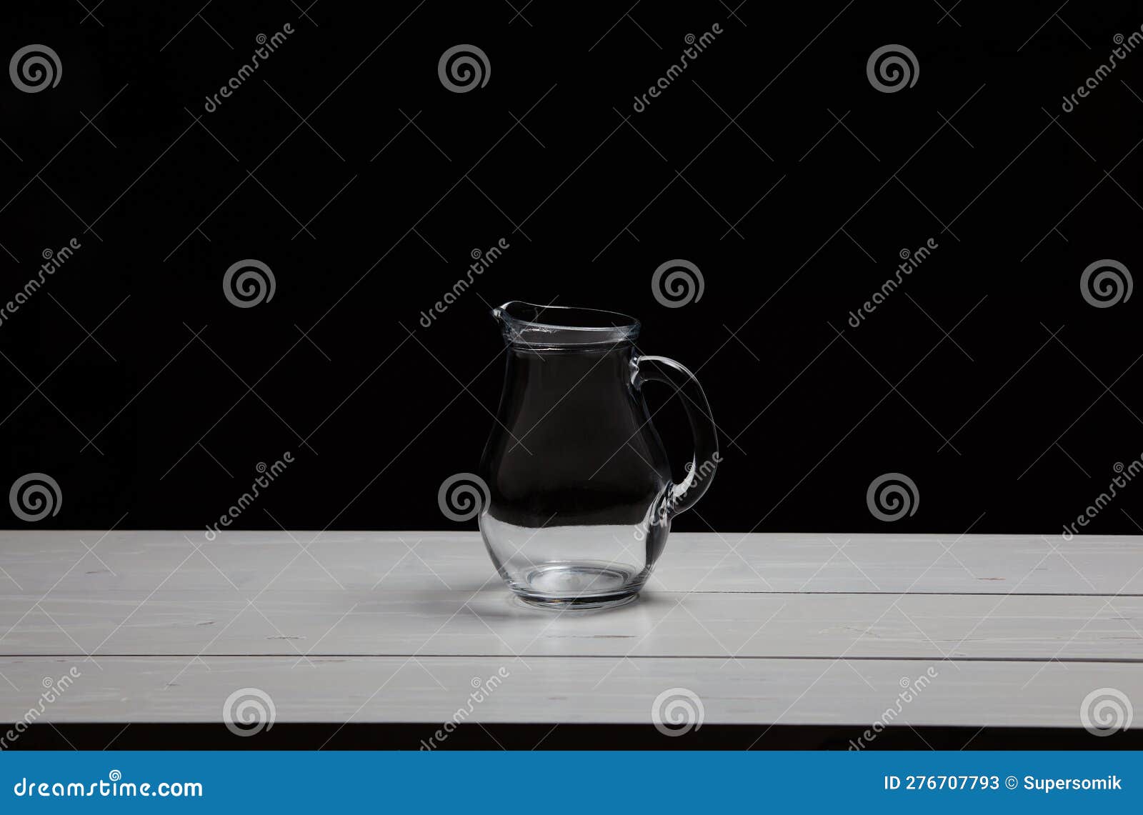 Glass water jug on table stock image. Image of clean - 276707793