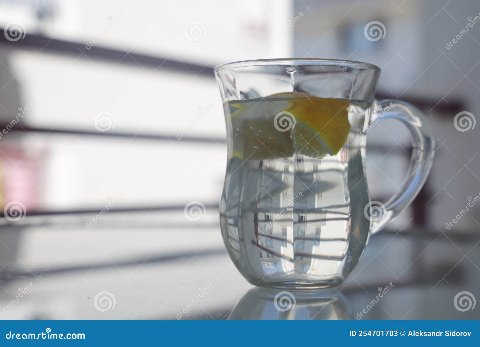 A Glass of Water with Lemon on a Glass Table in a Hotel. Stock Image ...