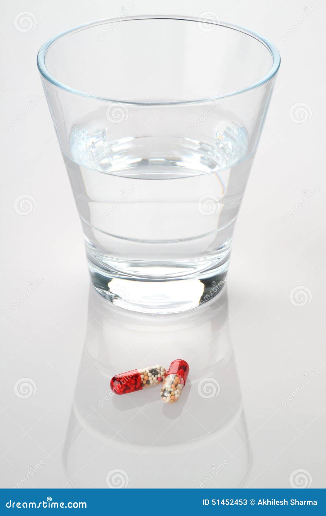 Glass of Water and Medicine Capsules Stock Image - Image of water ...