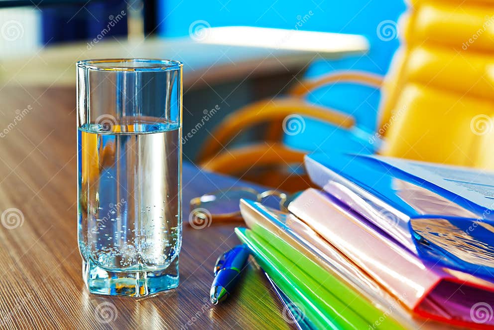 Glass of water in office stock image. Image of concept - 19106401