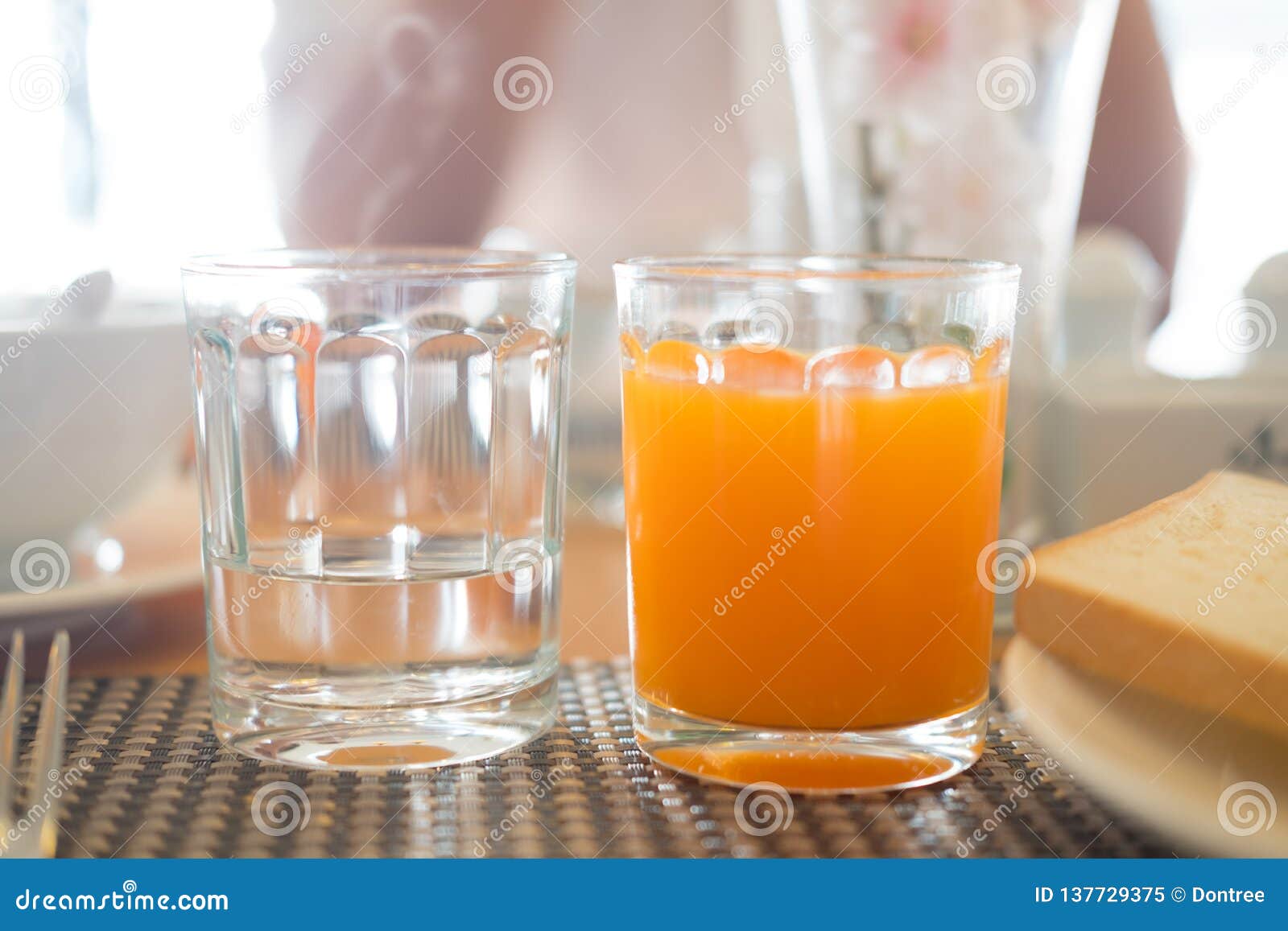 Glass of Water and Orange Juice Stock Image - Image of delicious, glass ...