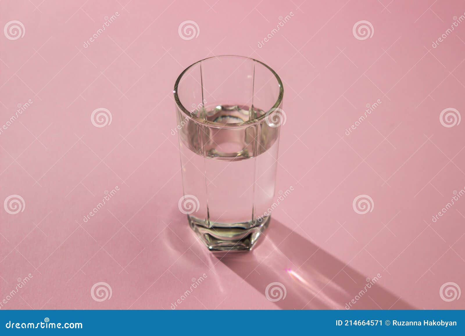 Glass of Water on a Pink Background. Clean Drinking Water Stock Image ...