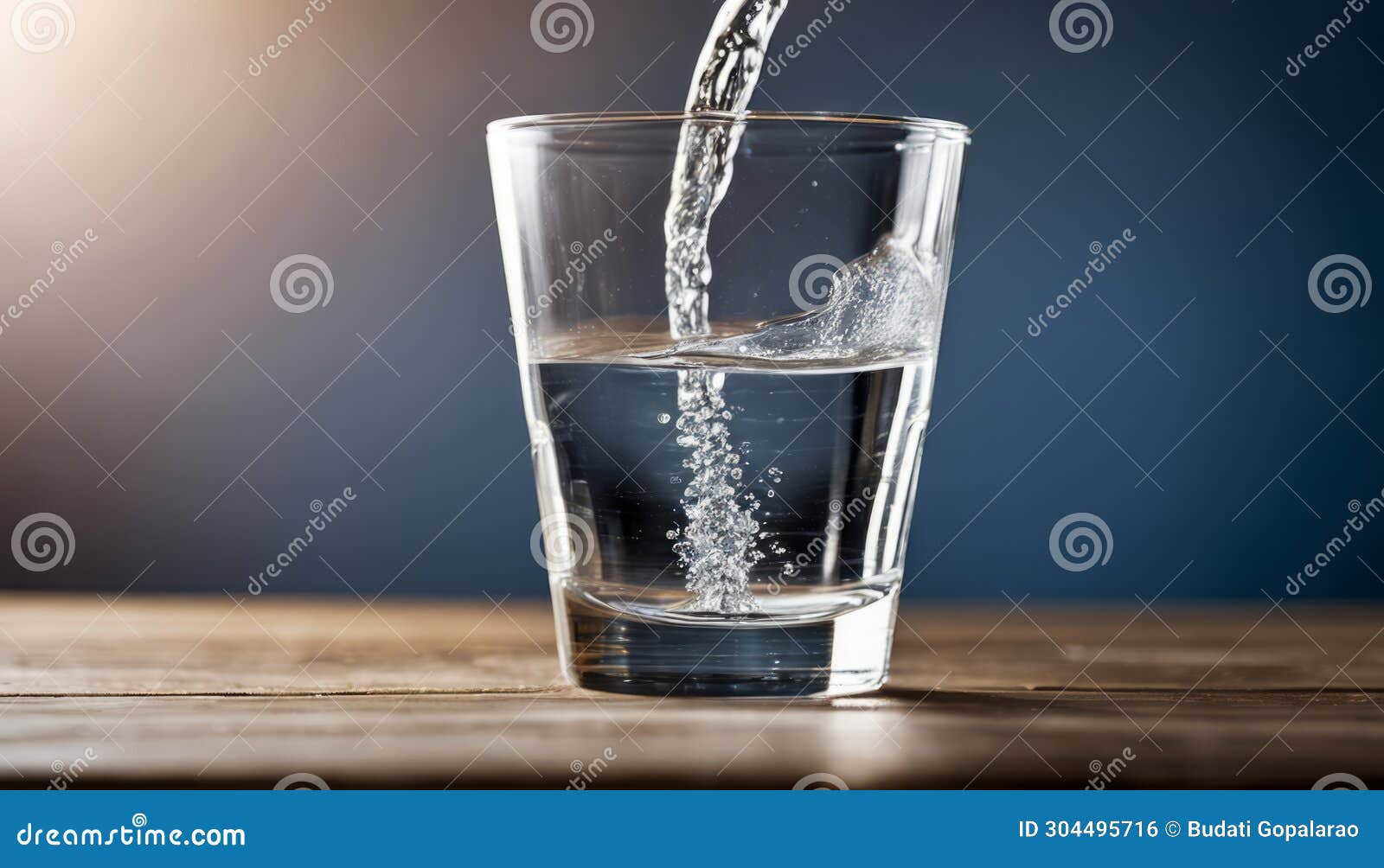 A Glass of Water with a Single Drop of Water Falling into it Stock ...