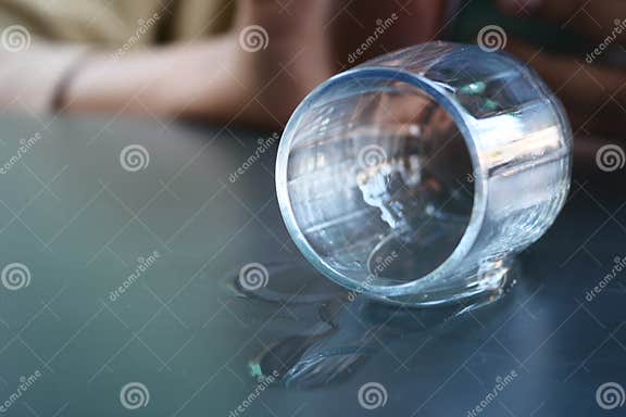A Glass of Water Spilled on a Table , Stock Photo - Image of splashing ...