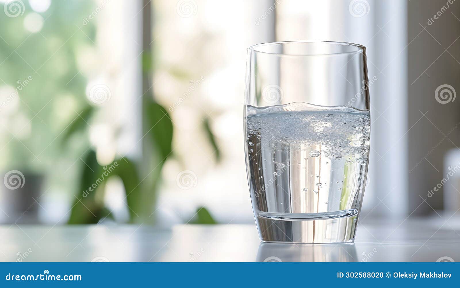 Glass with Water Stand on Table Over Blurred Kitchen Background Stock ...