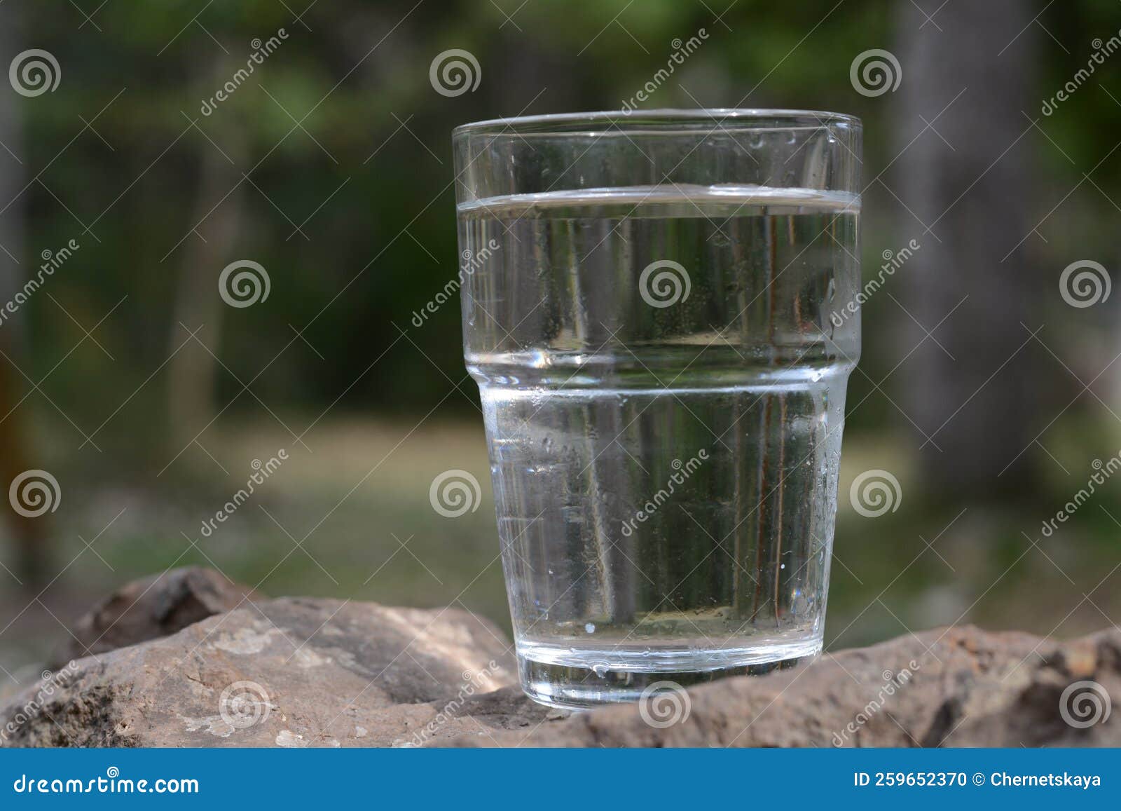Glass of Water on Stone Outdoors, Space for Text Stock Photo - Image of ...