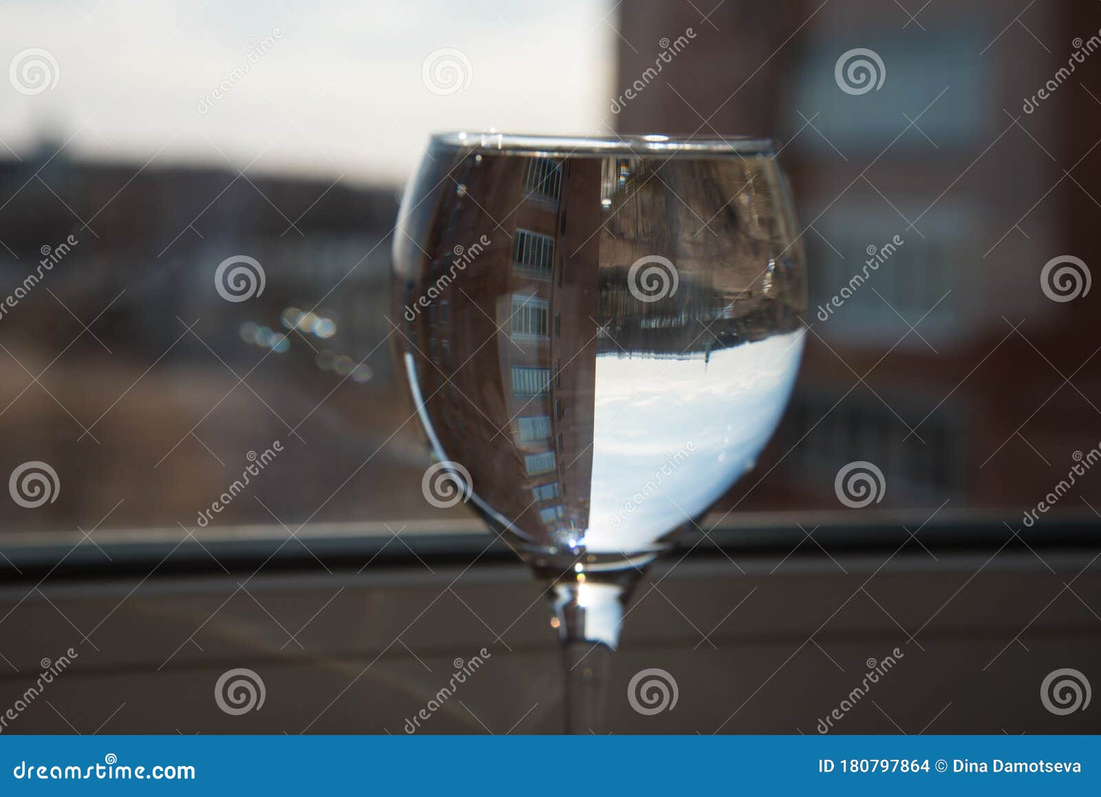 A Glass of Water on a Thin Leg Stands on the Windowsill. Interesting ...