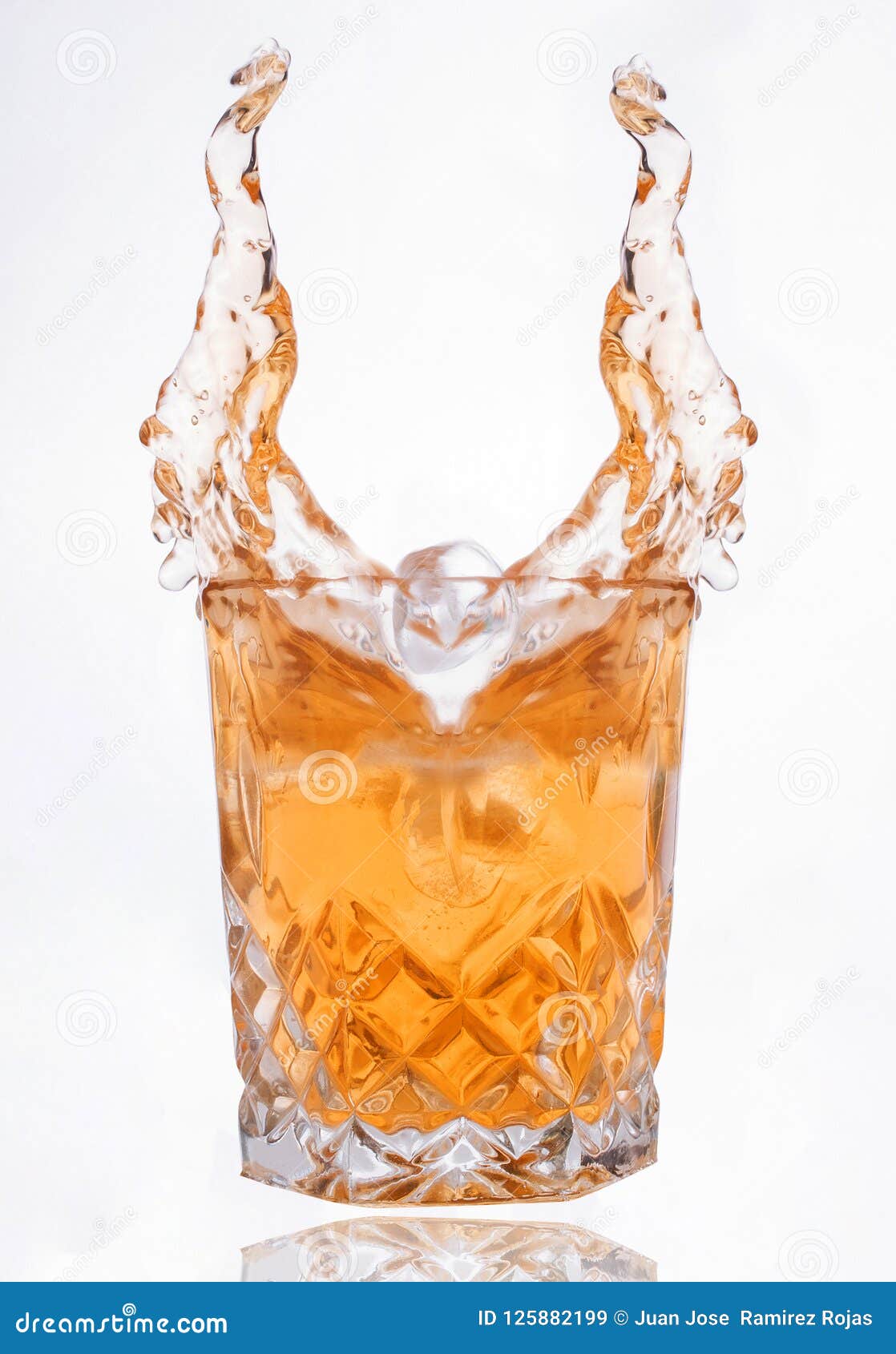 Glass of whiskey splash stock image. Image of motion - 125882199