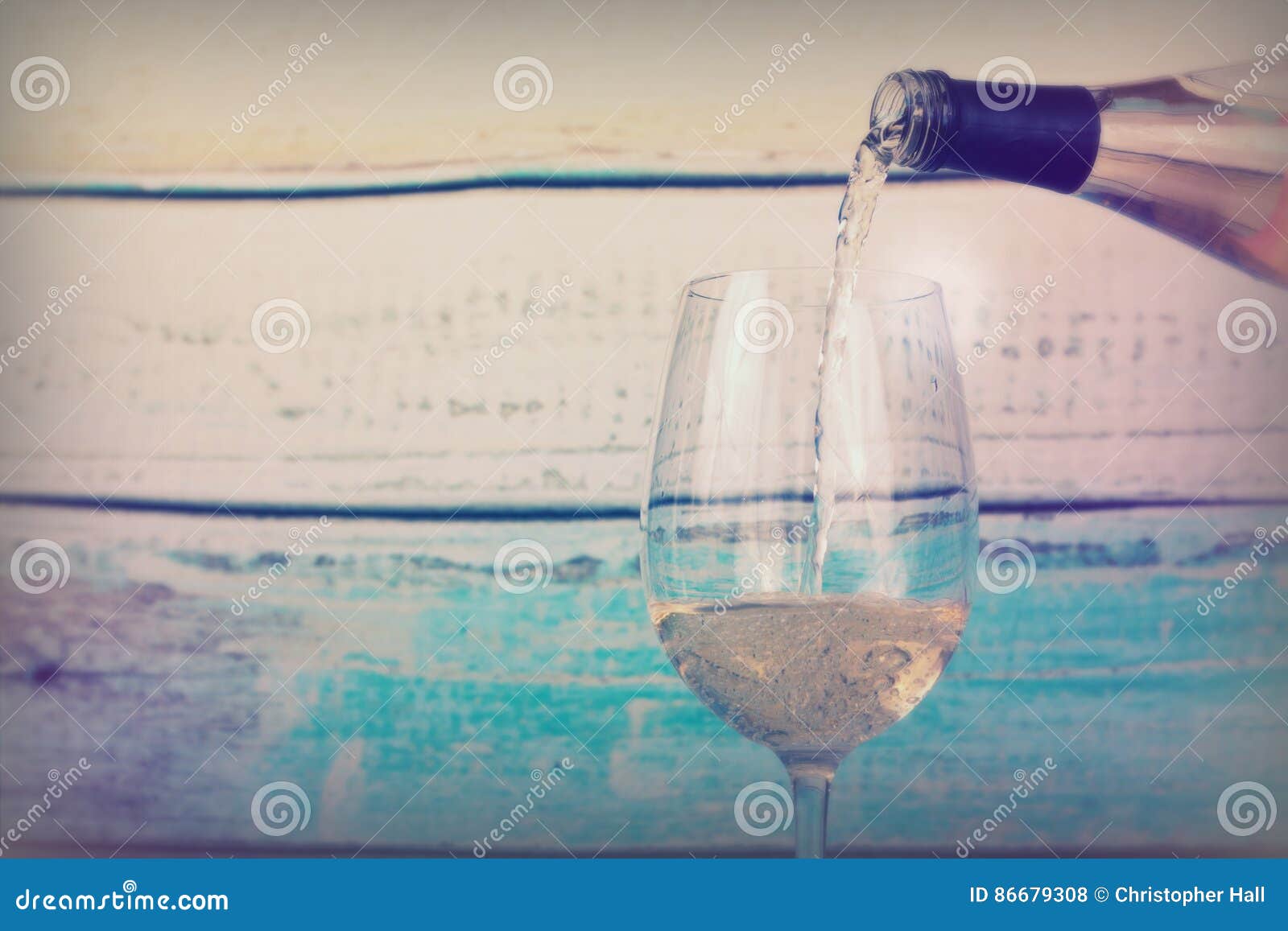 Glass of White Wine Being Poured from Bottle Stock Photo - Image of ...