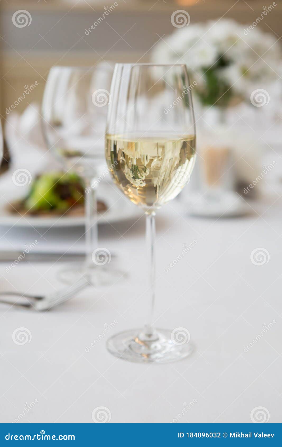 Glass of white wine stock photo. Image of luxury, yellow - 184096032