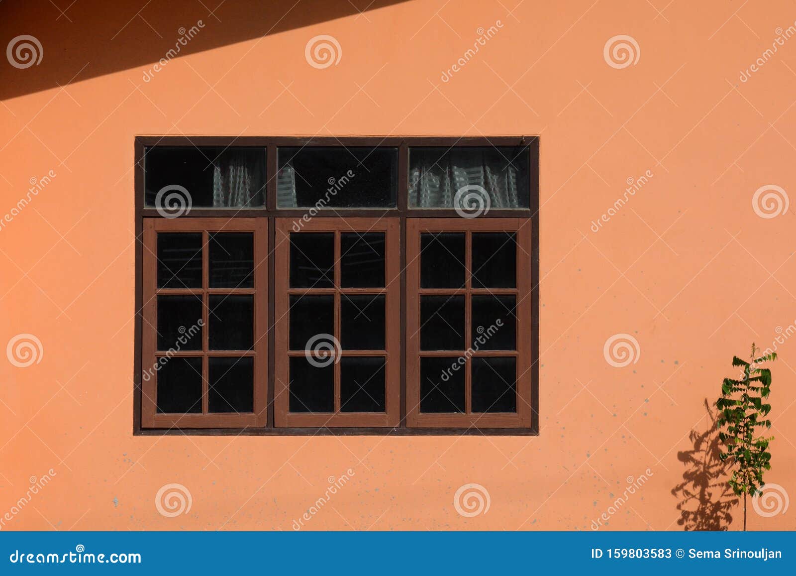 Glass Window at Pale Orange Concrete Building. Stock Image - Image of ...