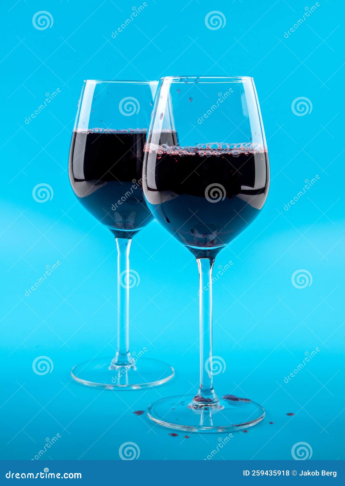 A Glass of Wine on a Blue Background. Stock Photo - Image of ...