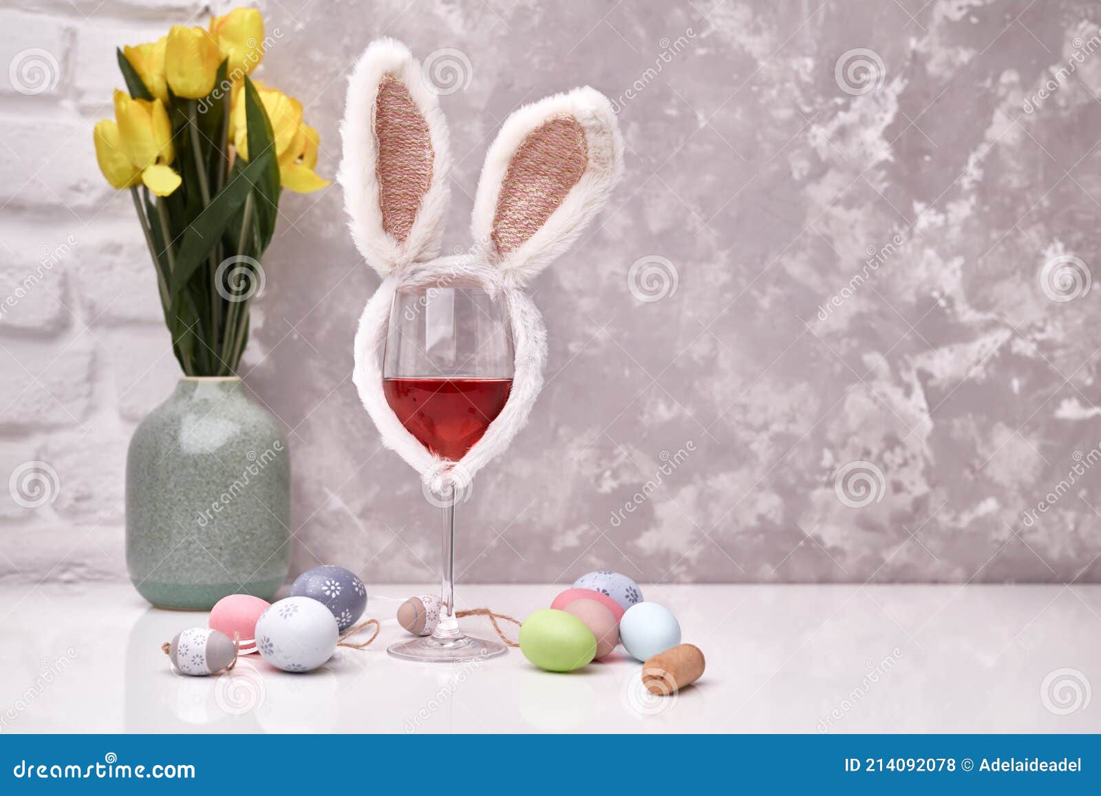 Glass of Wine with Bunny Ears and Easter Decorations, Colorful Eggs on ...