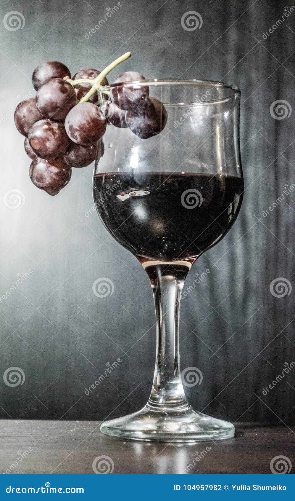 A Glass of Wine with a Cluster of Grapes Stock Photo - Image of tree ...