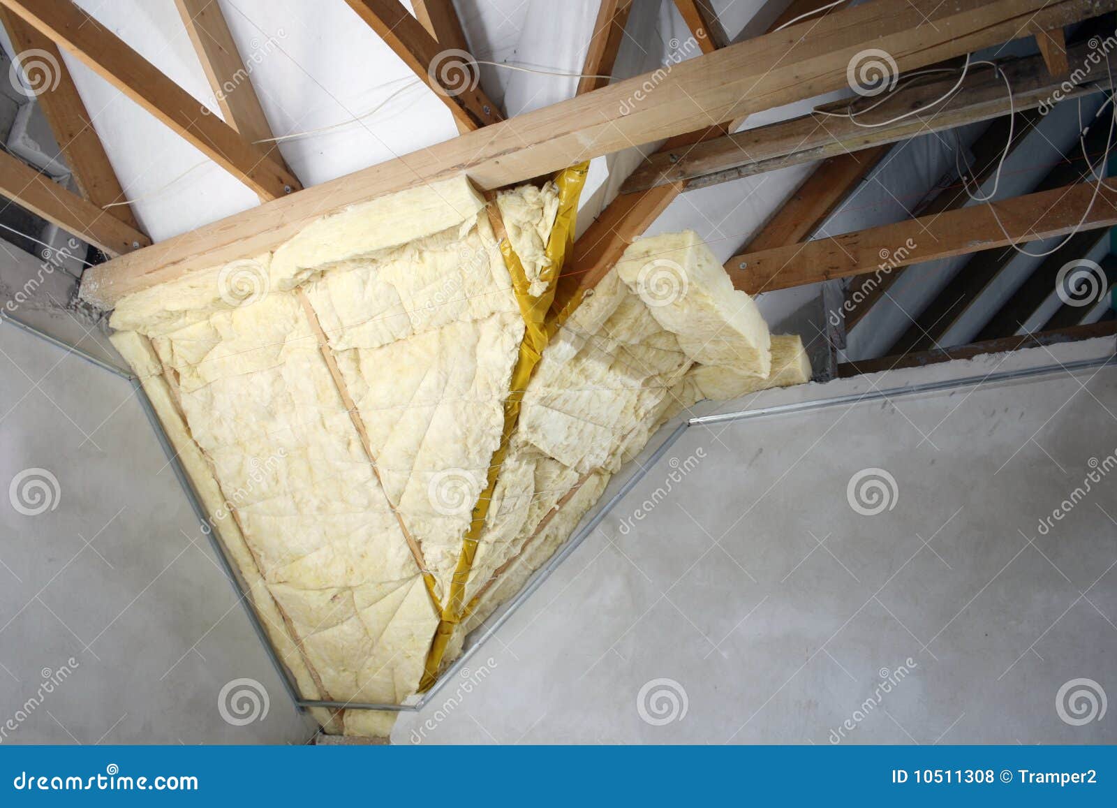 Glass Wool Insulation. The Worker Insulates The House Standing On The ...