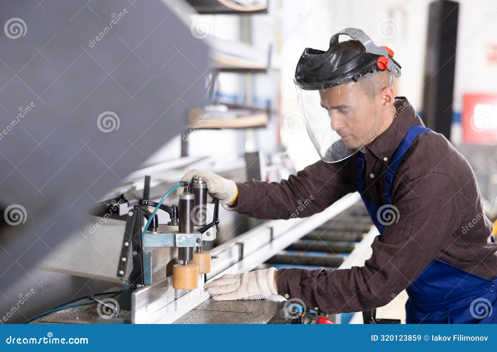 Glass Workshop - Man Works on Machine for Cutting Aluminum Profiles for ...
