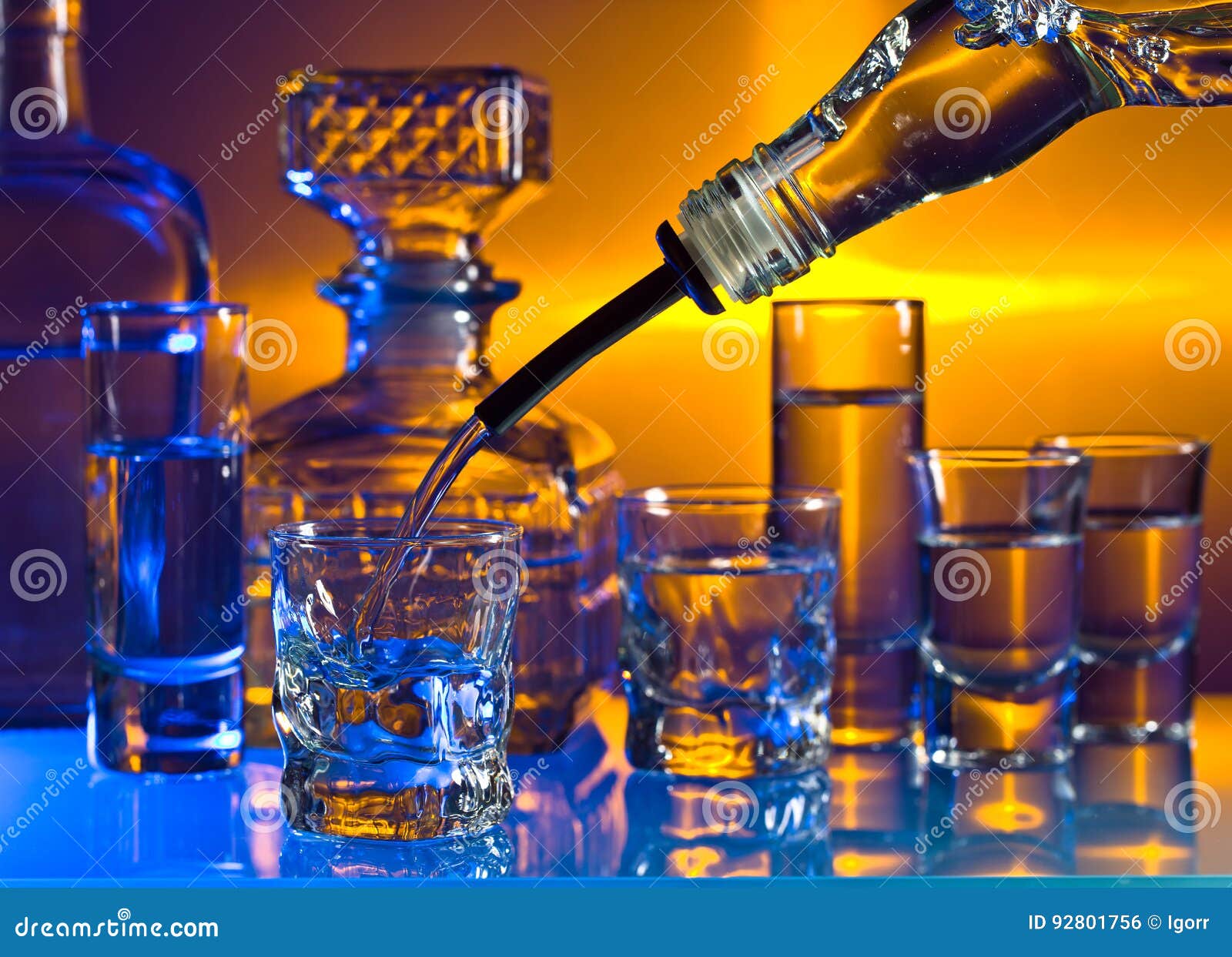 Glasses with Alcoholic Drinks on a Glass Table in Bar Stock Photo ...