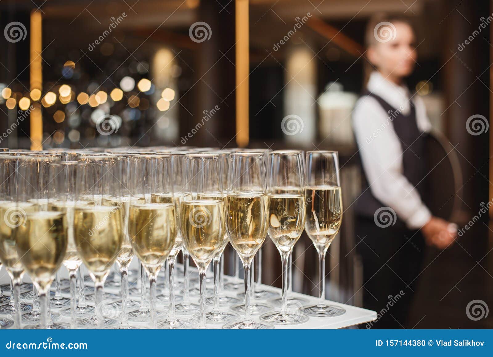 Glasses with Champagne at Buffet and Waiter on Background Stock Photo ...